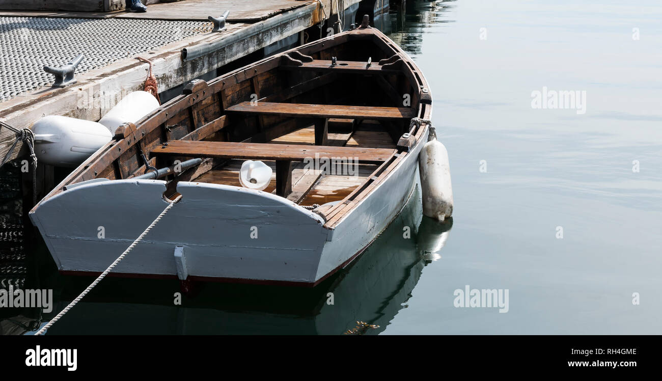 Empty rowboat in water hi-res stock photography and images - Alamy