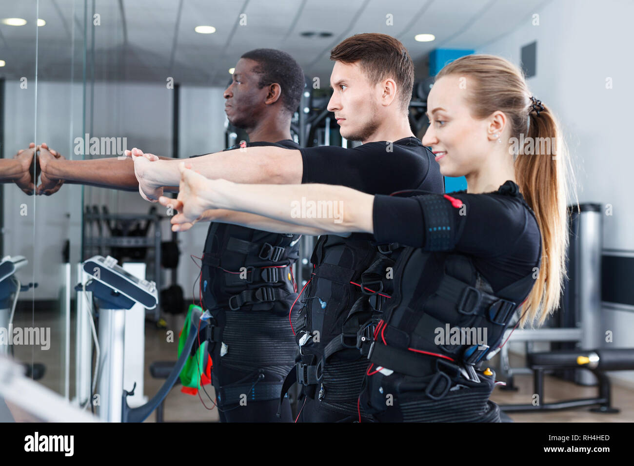 Athletic cheerful positive people during functional workout with ...