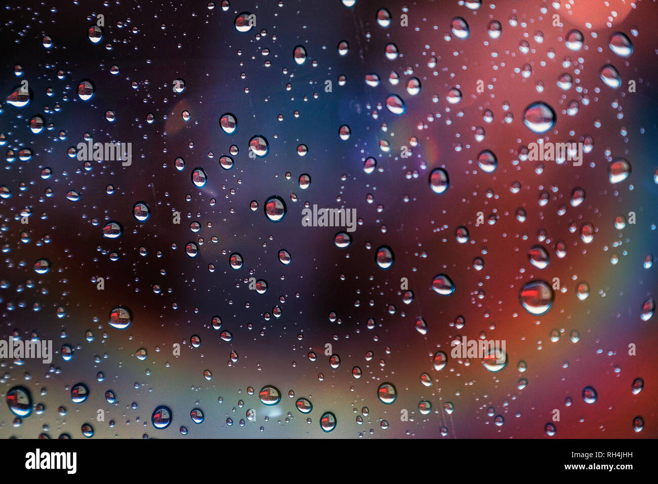 drops reflected in the window with colorful reflections Stock Photo - Alamy