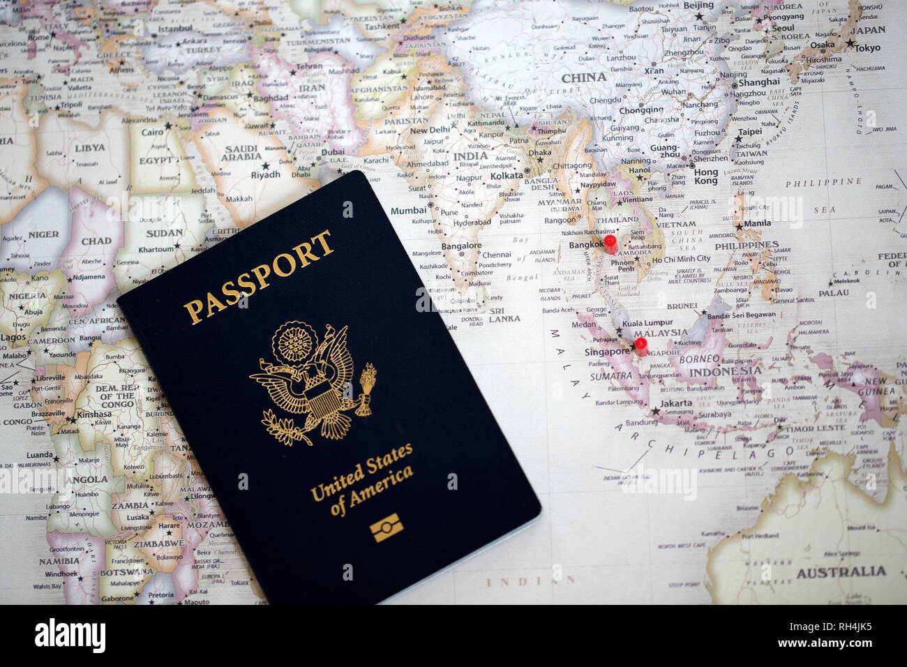 Passport on the world map Stock Photo - Alamy