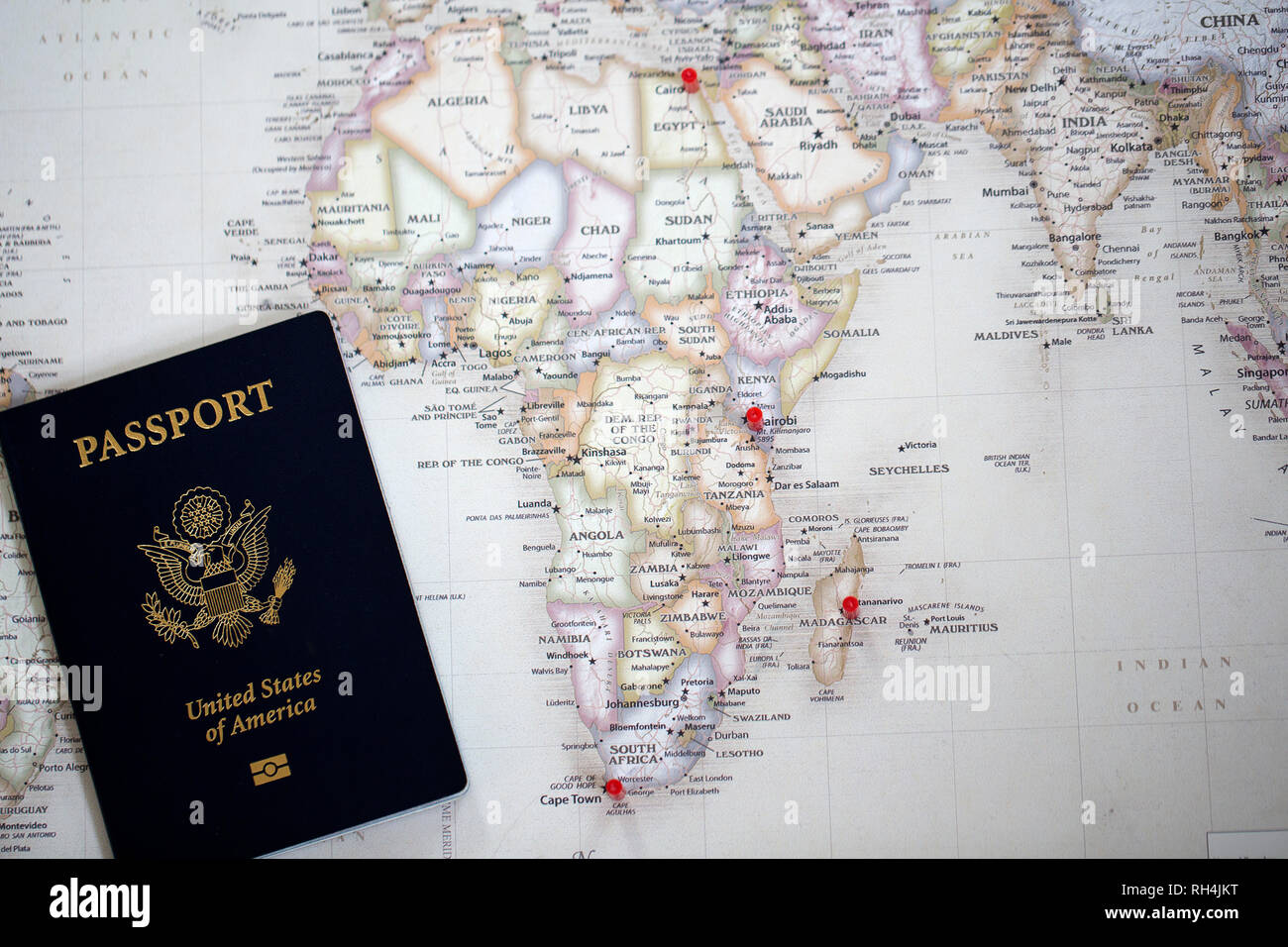 Passport on the world map Stock Photo - Alamy