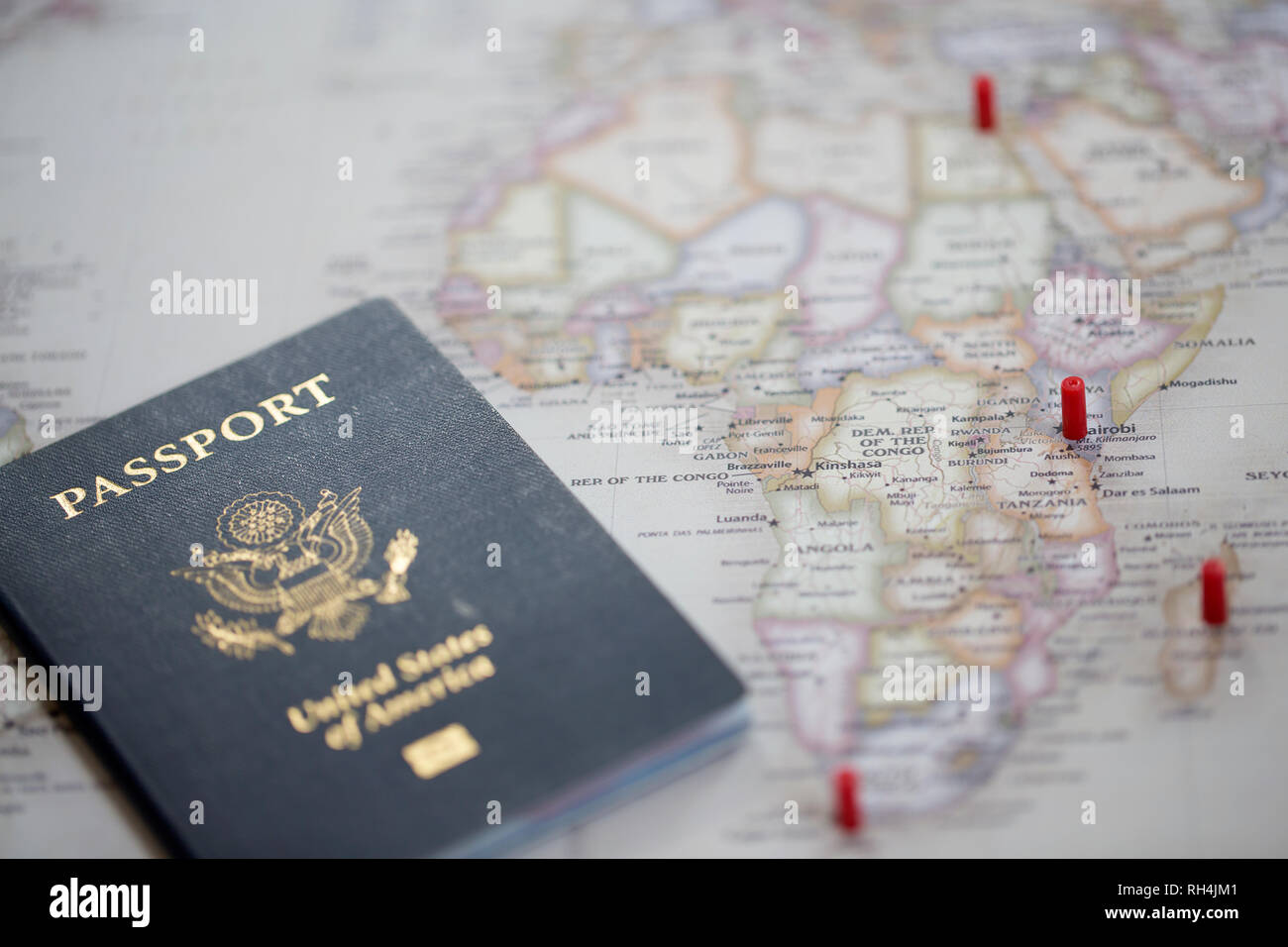 Passport on the world map Stock Photo - Alamy