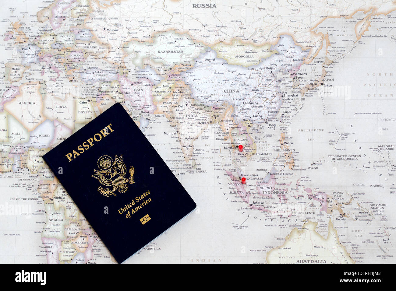 Passport on the world map Stock Photo - Alamy
