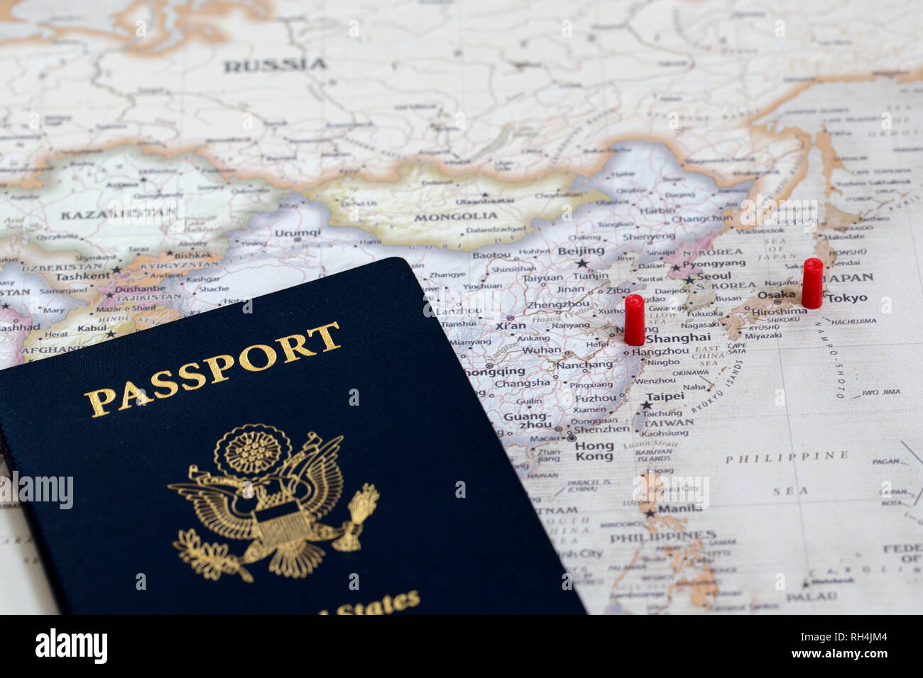 Passport on the world map Stock Photo - Alamy