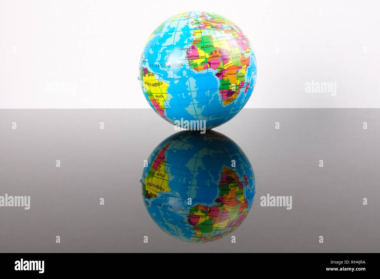World globe with reflection. Globalization Concept Stock Photo - Alamy