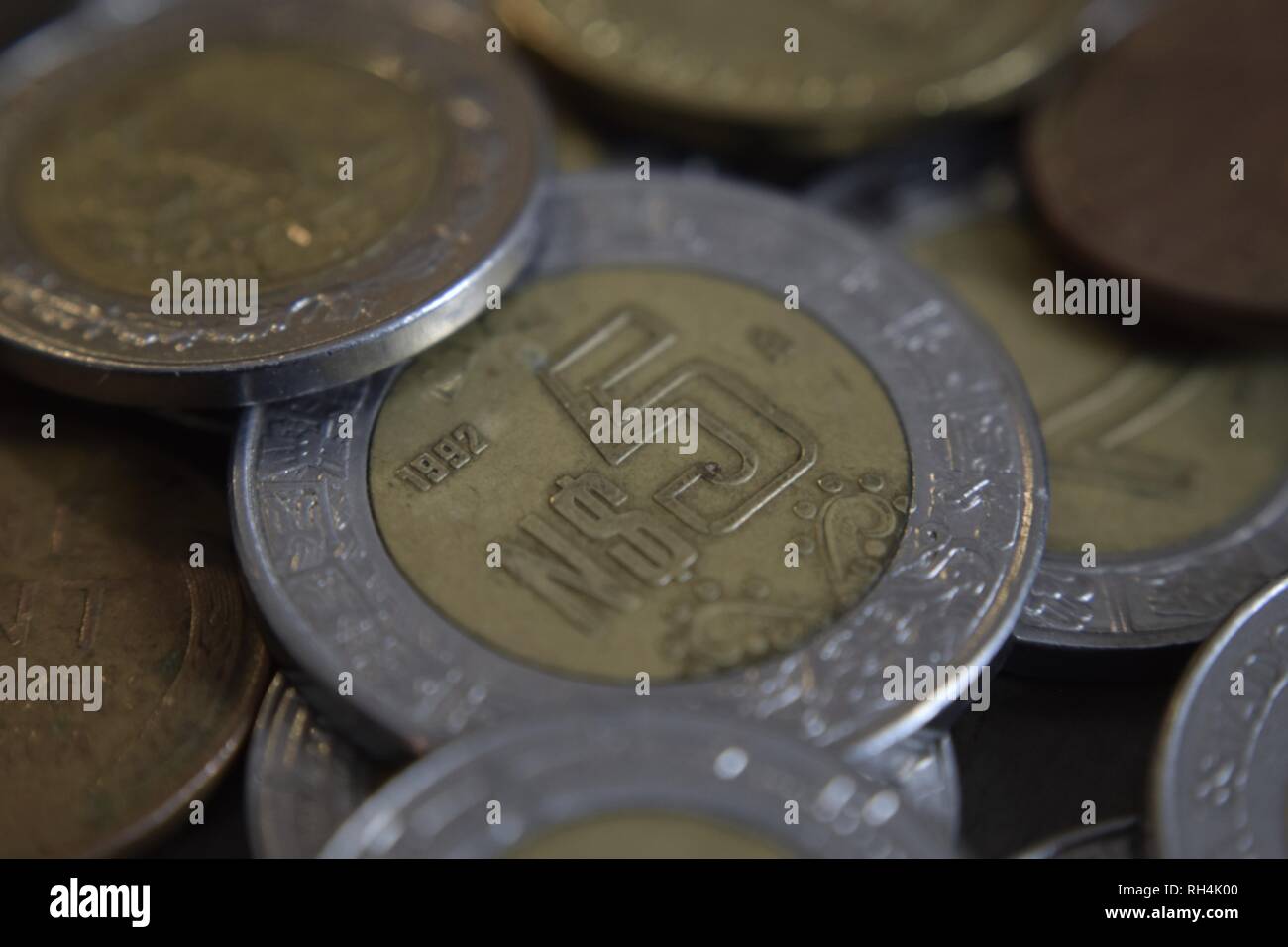 Small Pile of Mexican Pesos Stock Photo - Alamy