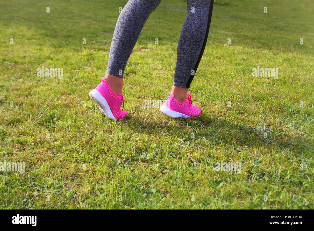 Runner athlete preparing to run the outdoor. Fitness woman training and ...