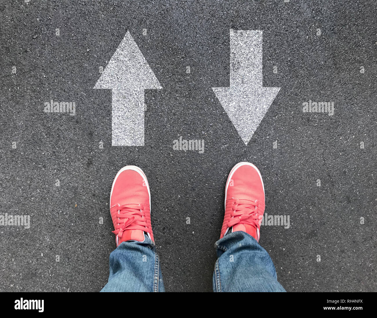 Direction arrows on asphalt hi-res stock photography and images - Alamy