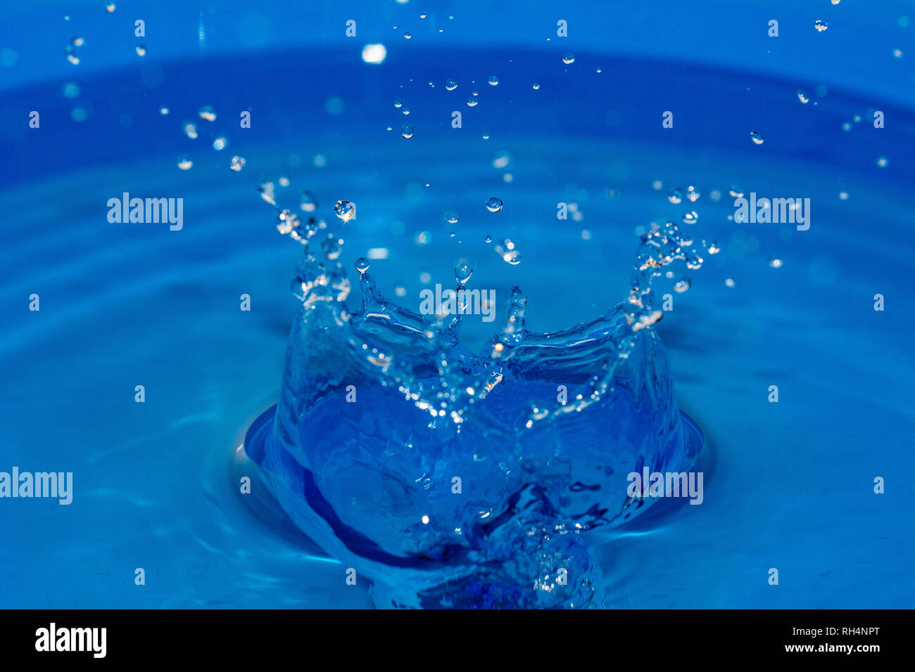 Water drop falling and drips on mirror. Water drop splash and make ...