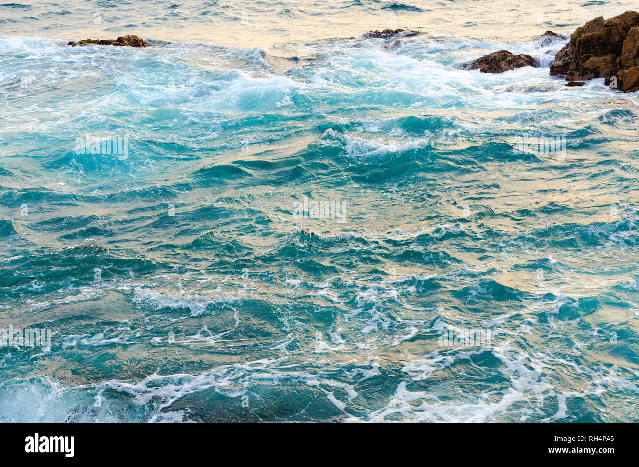 Clean, clear sea water hits stones, wave and beach, nature background ...