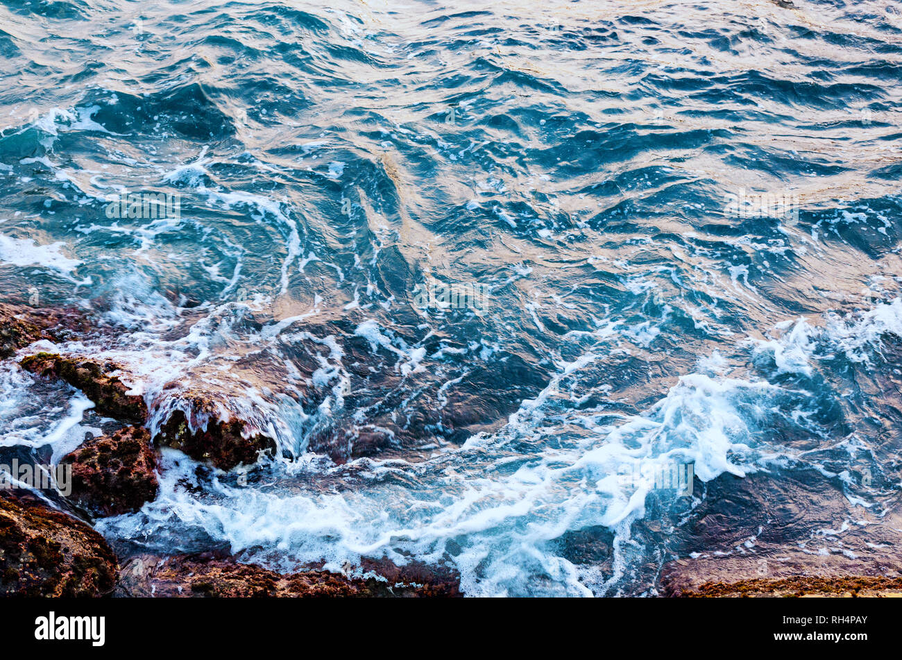 Sea water hits stone beach, wave and beach, nature background concept ...