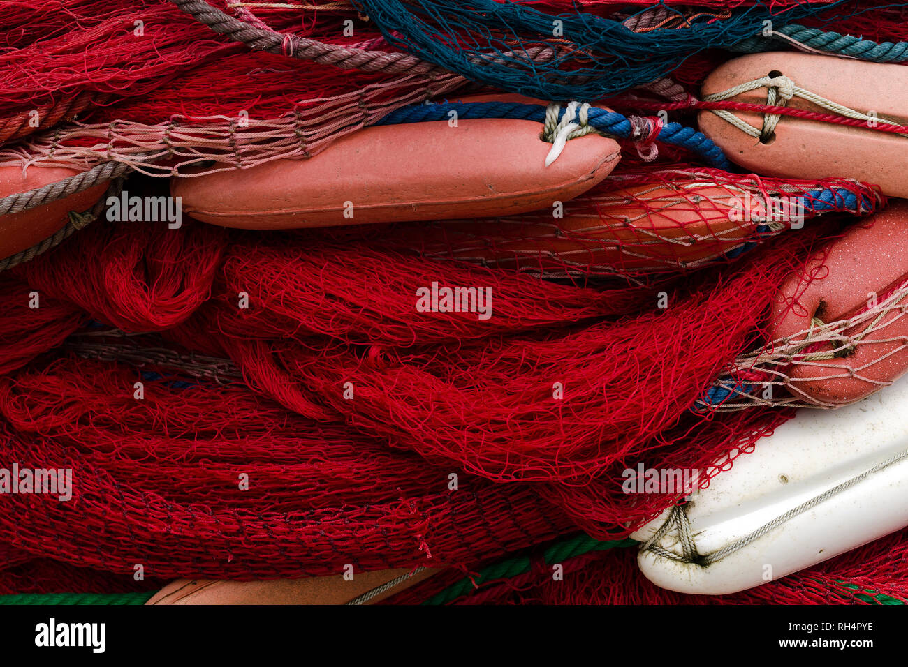 Fishing nets with floats. Rope texture, Background with blue and red ...