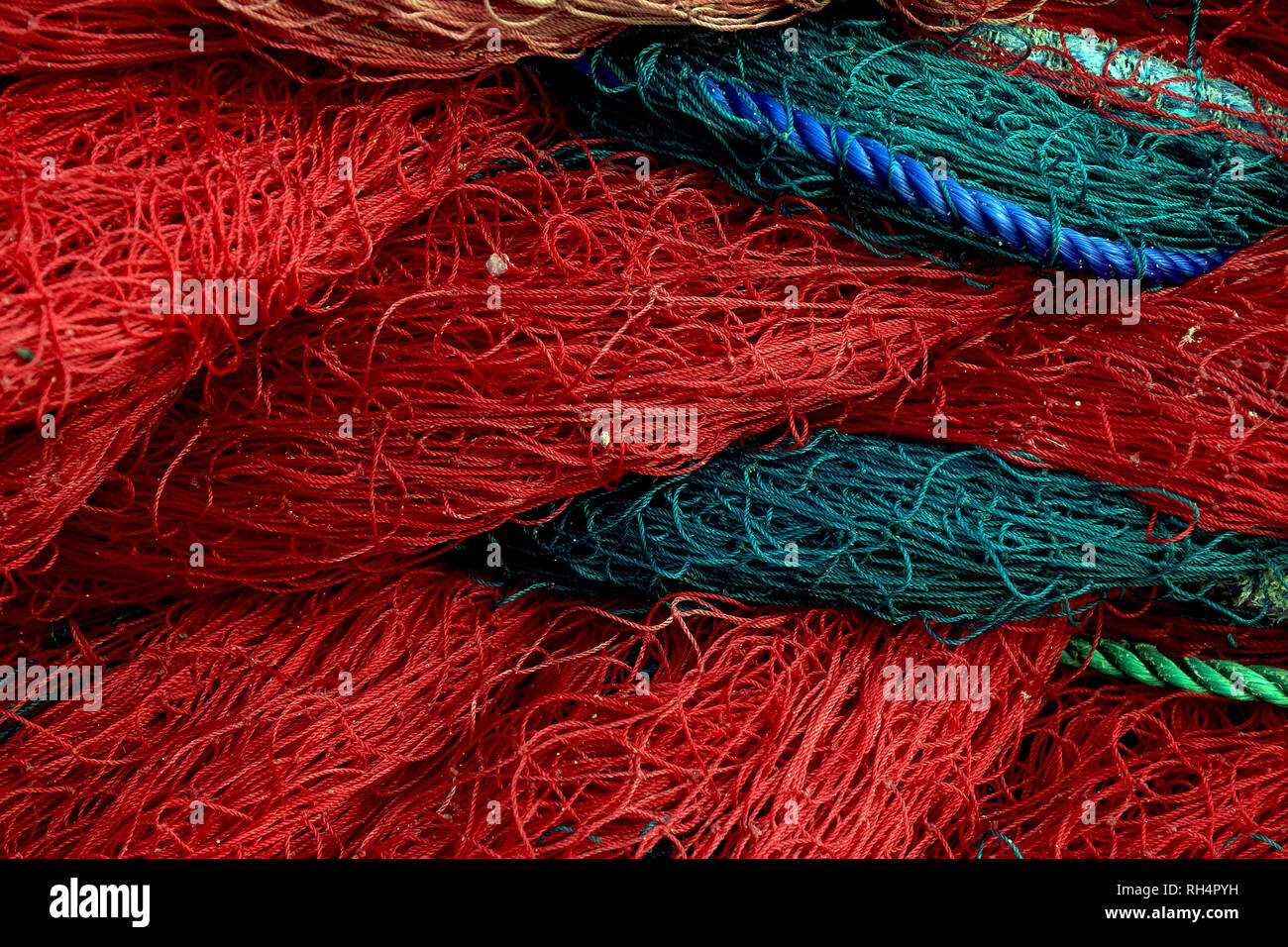 Fishing net closeup. Rope texture, Background with blue and red ropes ...