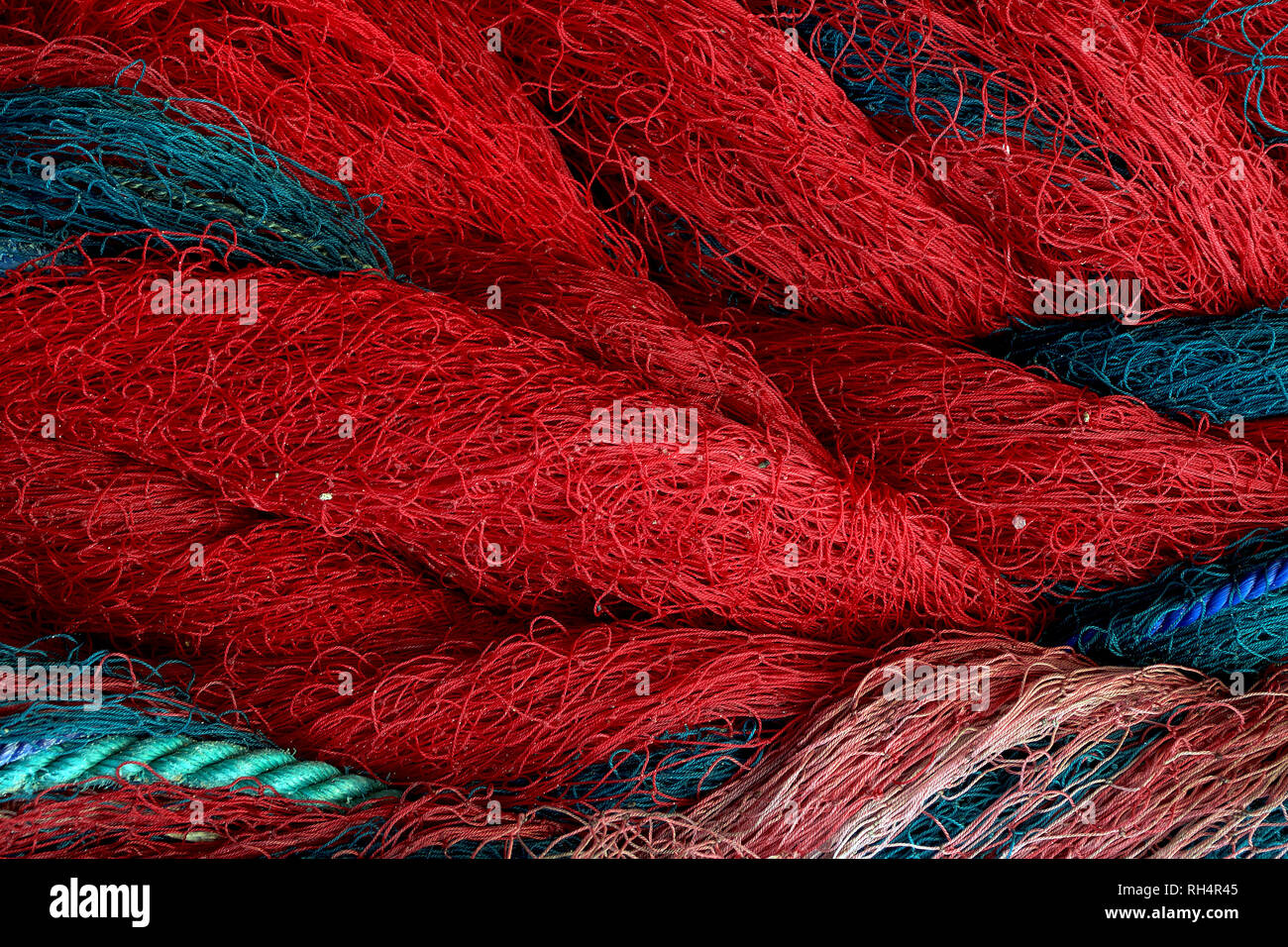 Fishing net closeup. Rope texture, Background with blue and red ropes ...