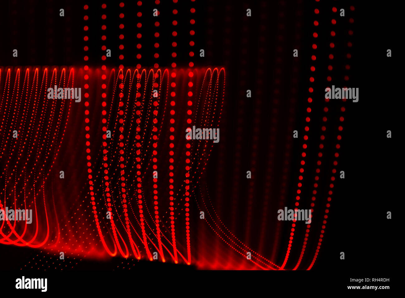 Several red dotted lines with abstract shapes. Light painting ...