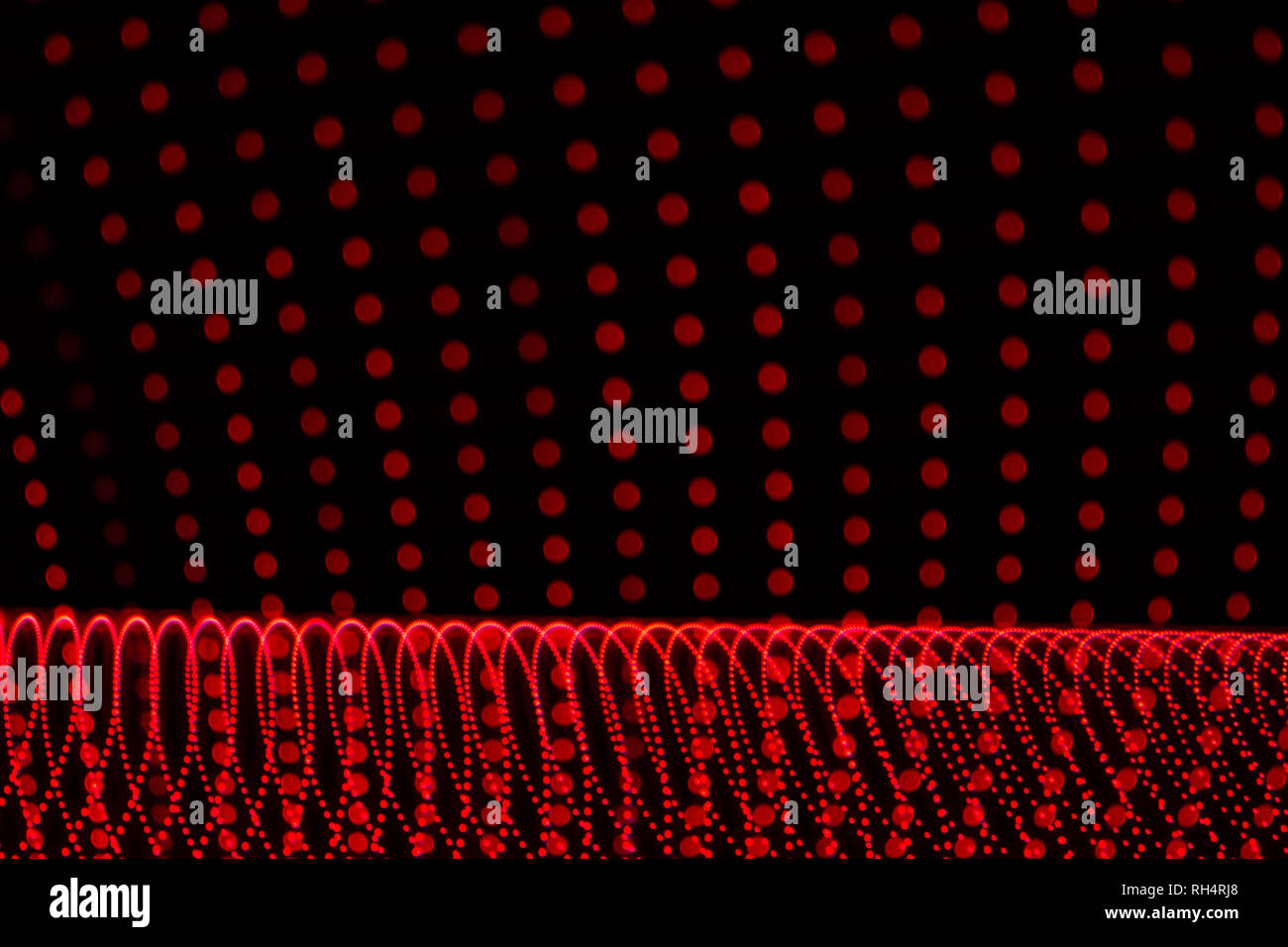 Several red dotted lines with abstract shapes. Light painting ...