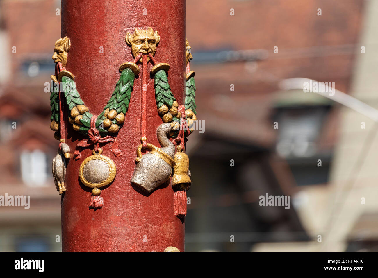 detail of colorful pillar and character adorning the medieval ...