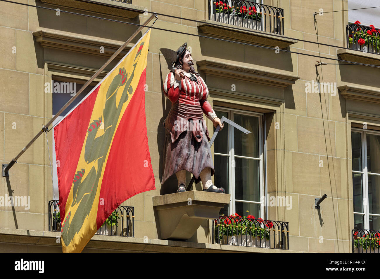 The statue of the butcher decorates frontage of a building in the old ...