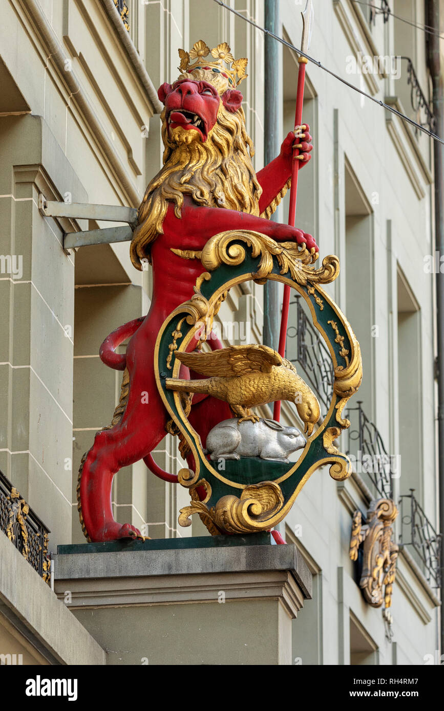 figure of a lion crowned with a rabbit and an eagle on a wall in the ...