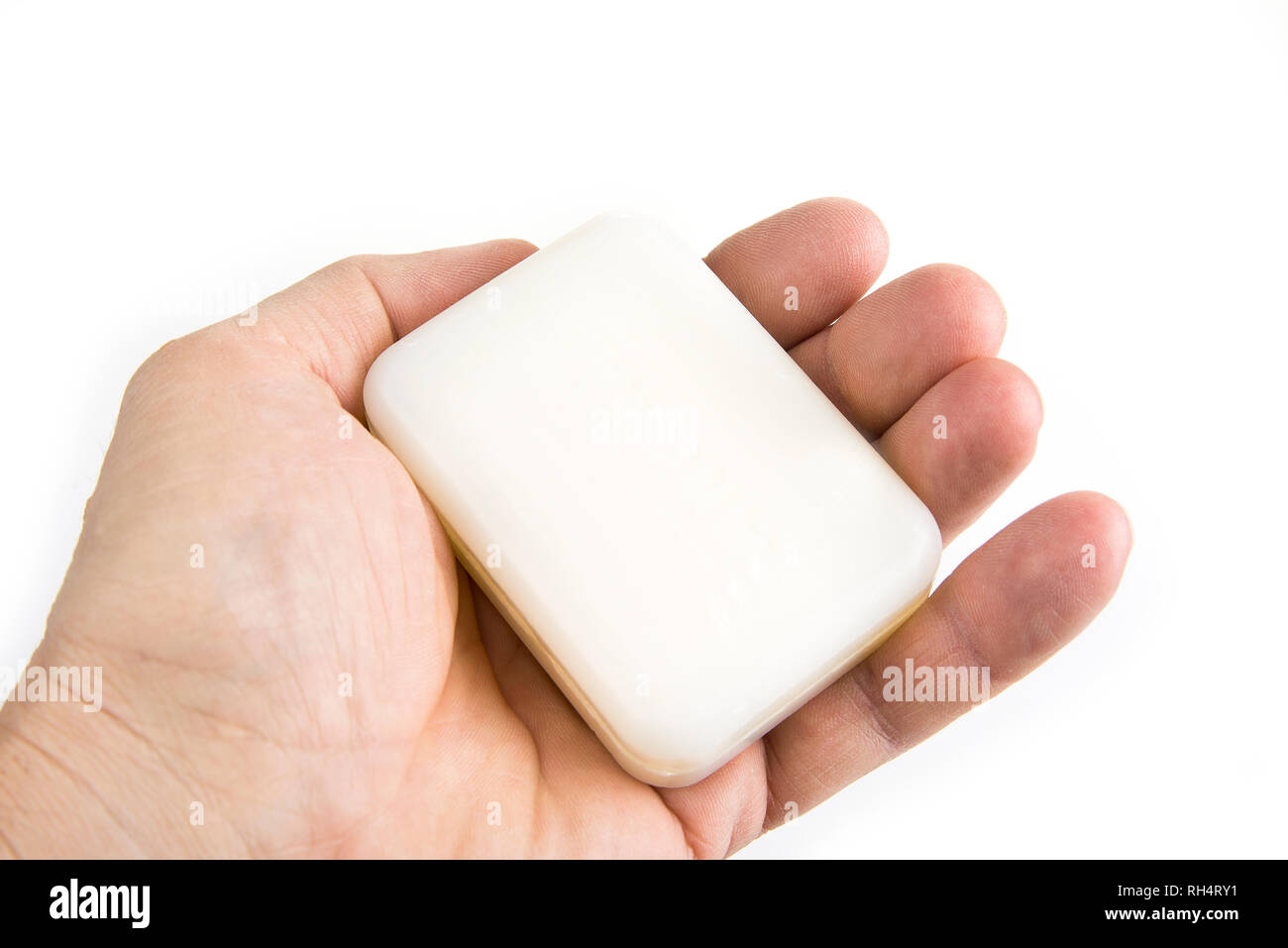 Soap in the male hand on the white Stock Photo - Alamy
