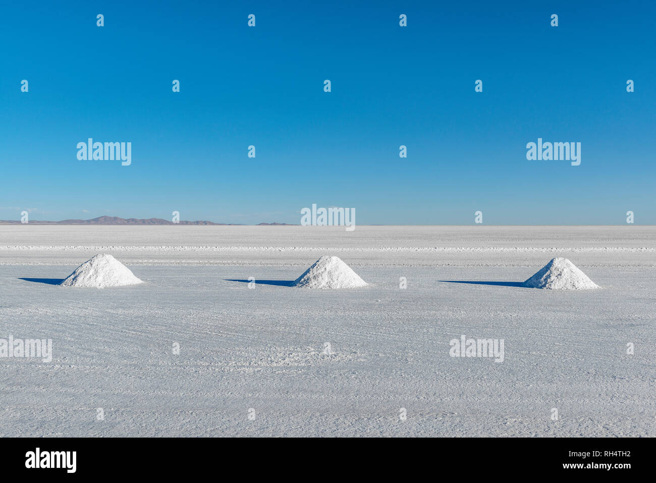 Salt pyramids near the town of Colchani with the infinity of the Uyuni ...