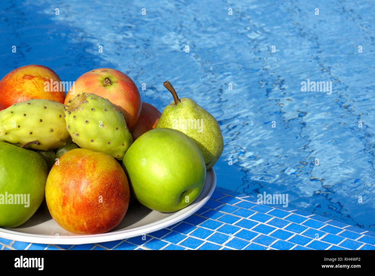 Plate of fresh fruit at the swimming pool Stock Photo - Alamy