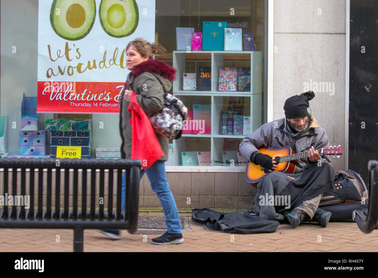 Homeless Busker with guitar, playing music, musician, street ...