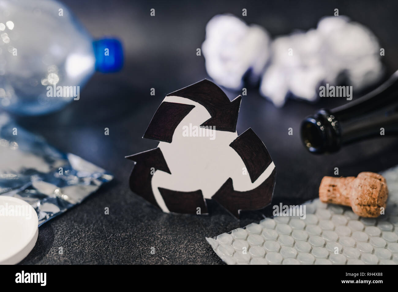 recycle symbol surrounded by reusable waste materials like plastic ...