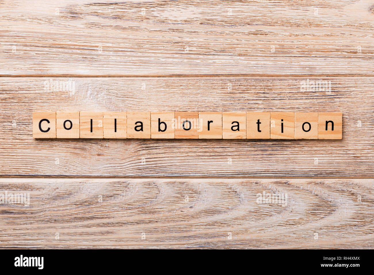Collaboration word written on wood block. Collaboration text on wooden ...