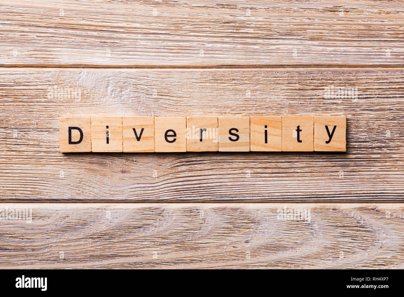 Diversity word written on wood block. Diversity text on wooden table ...