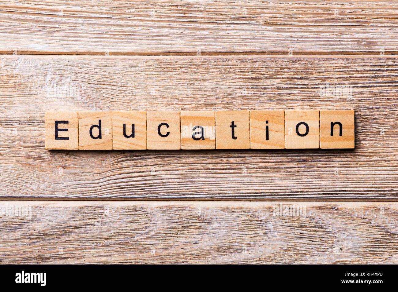 Education word written on wood block. Education text on wooden table ...