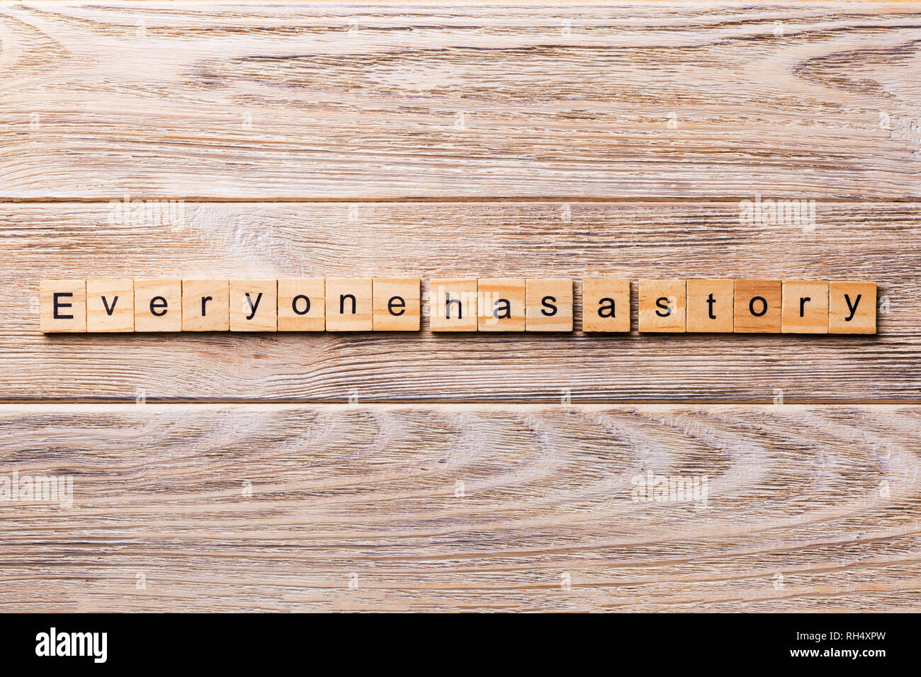 Everyone Has a Story word written on wood block. Everyone Has a Story ...