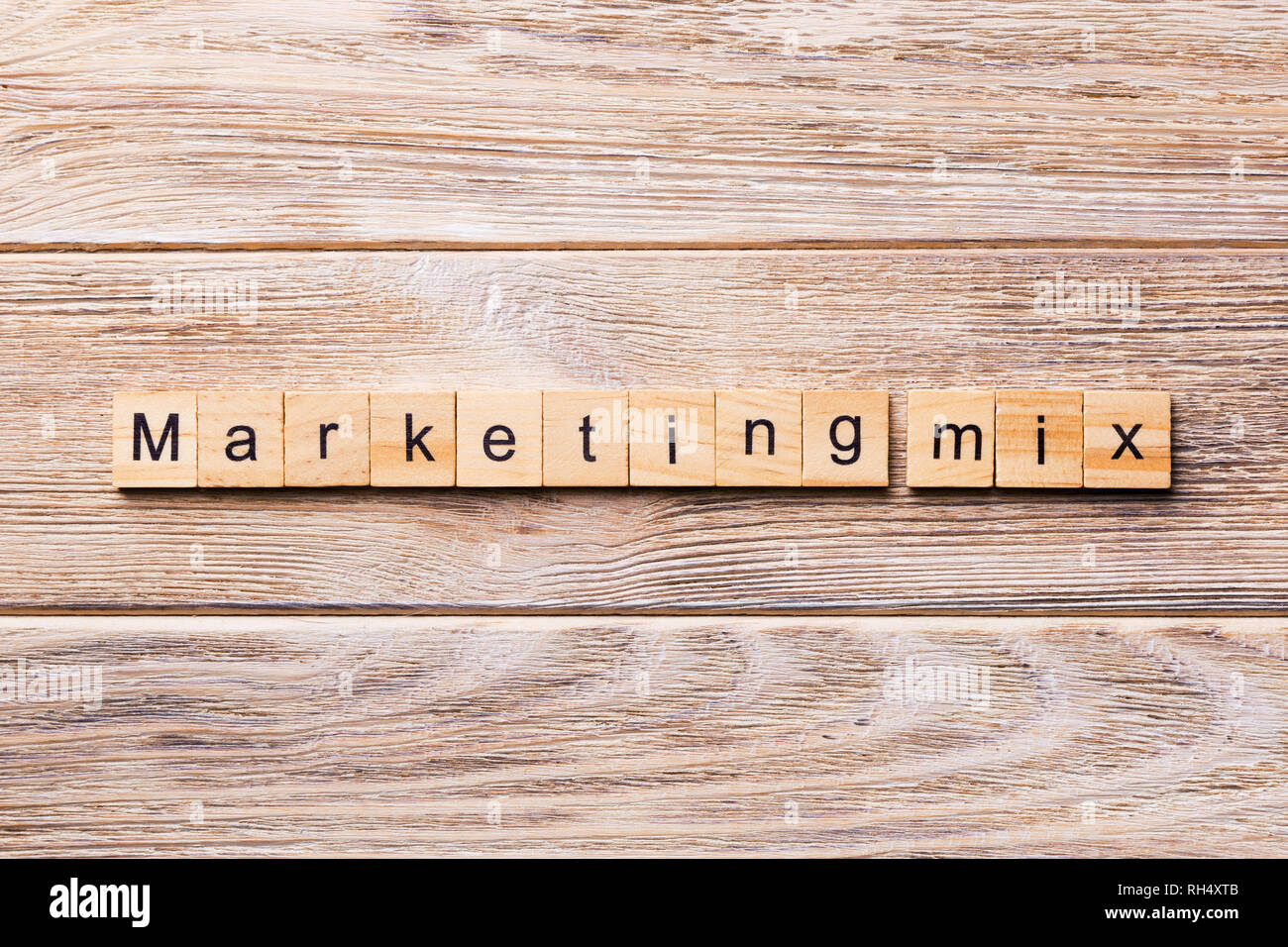 MARKETING MIX word written on wood block. MARKETING MIX text on wooden ...