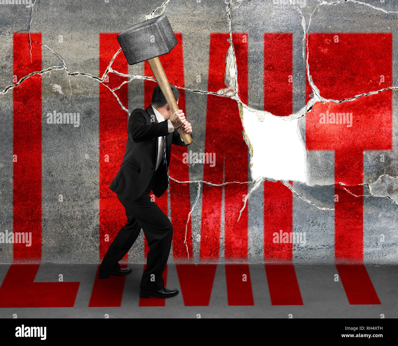 Destructing the wall with a large hammer and limit on it Stock Photo ...