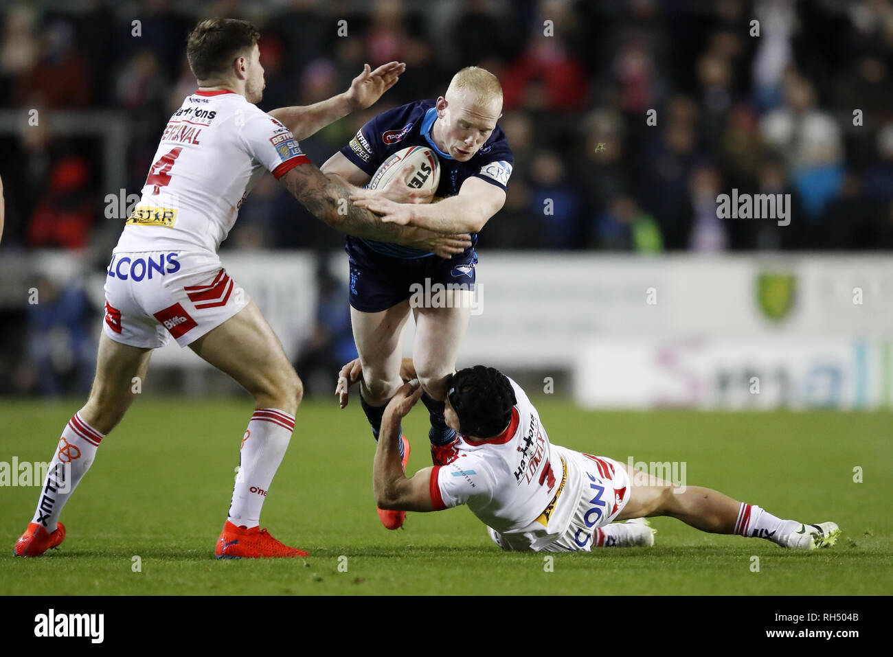 St Helens' Mark Percival and Jonny Lomax tackle Wigan Warriors' Liam ...