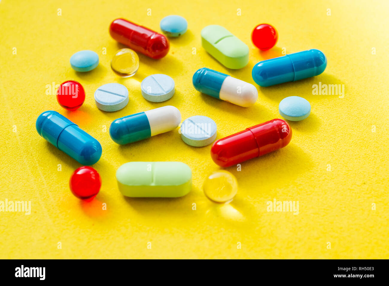 colorful pills and drugs in close up.assorted pills and capsules in ...