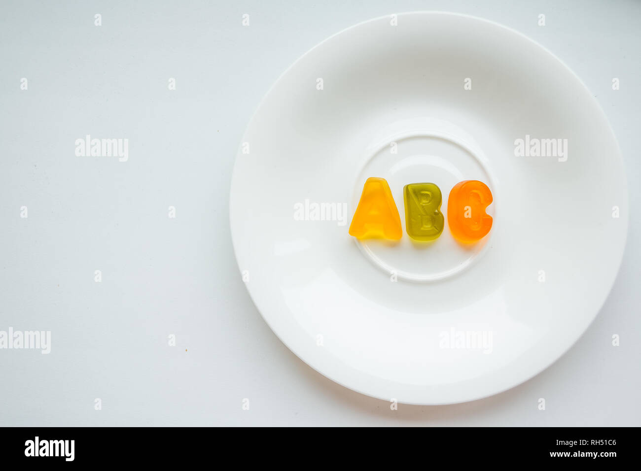 Jelly bean sweets and ABC letters. Education and alphabet concept Stock ...