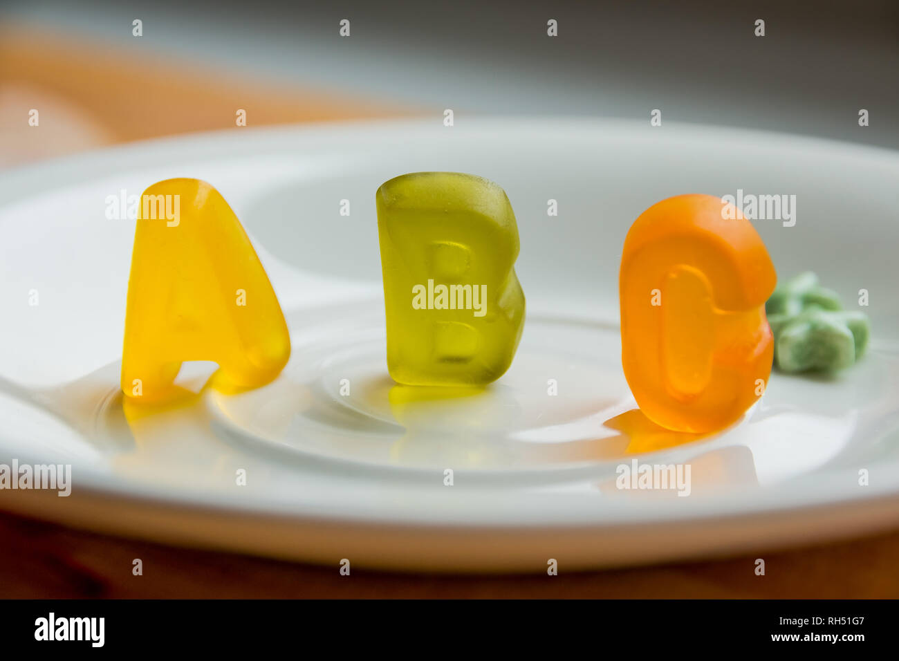 Jelly bean sweets and ABC letters. Education and alphabet concept Stock ...
