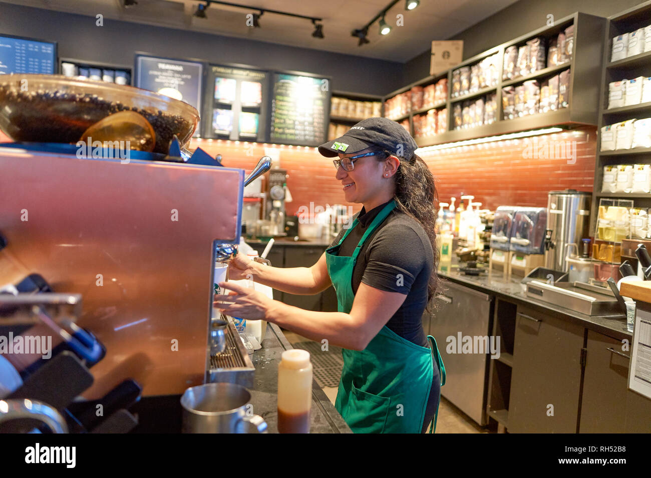 NEW YORK - CIRCA MARCH 2016: worker at Starbucks Cafe. Starbucks ...