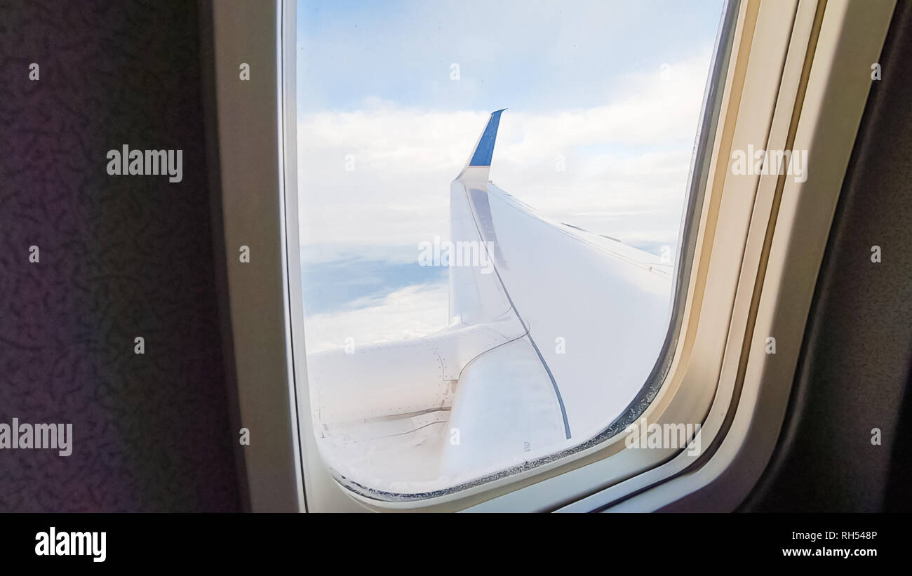 View from the window seat of commercial passenger airplane Stock Photo ...