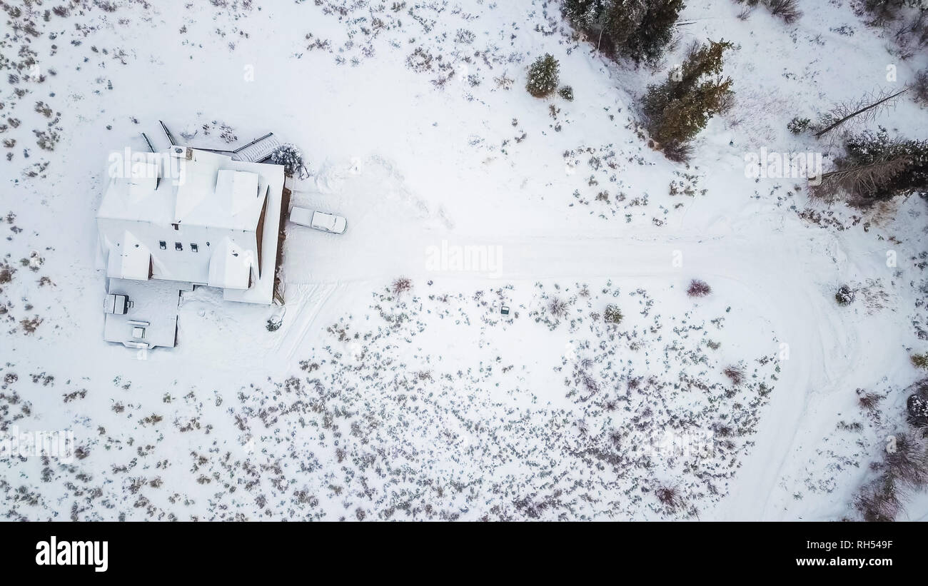 Aerial view of the mountain house covered in snow in the Winter Stock ...