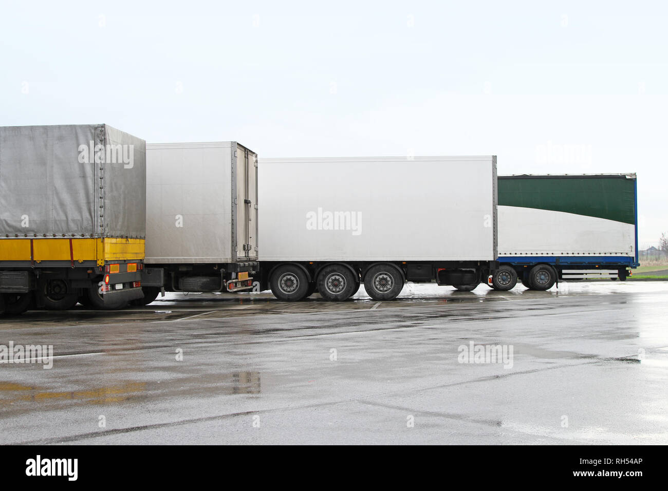 Several heavy weight lorry trailers at parking Stock Photo - Alamy