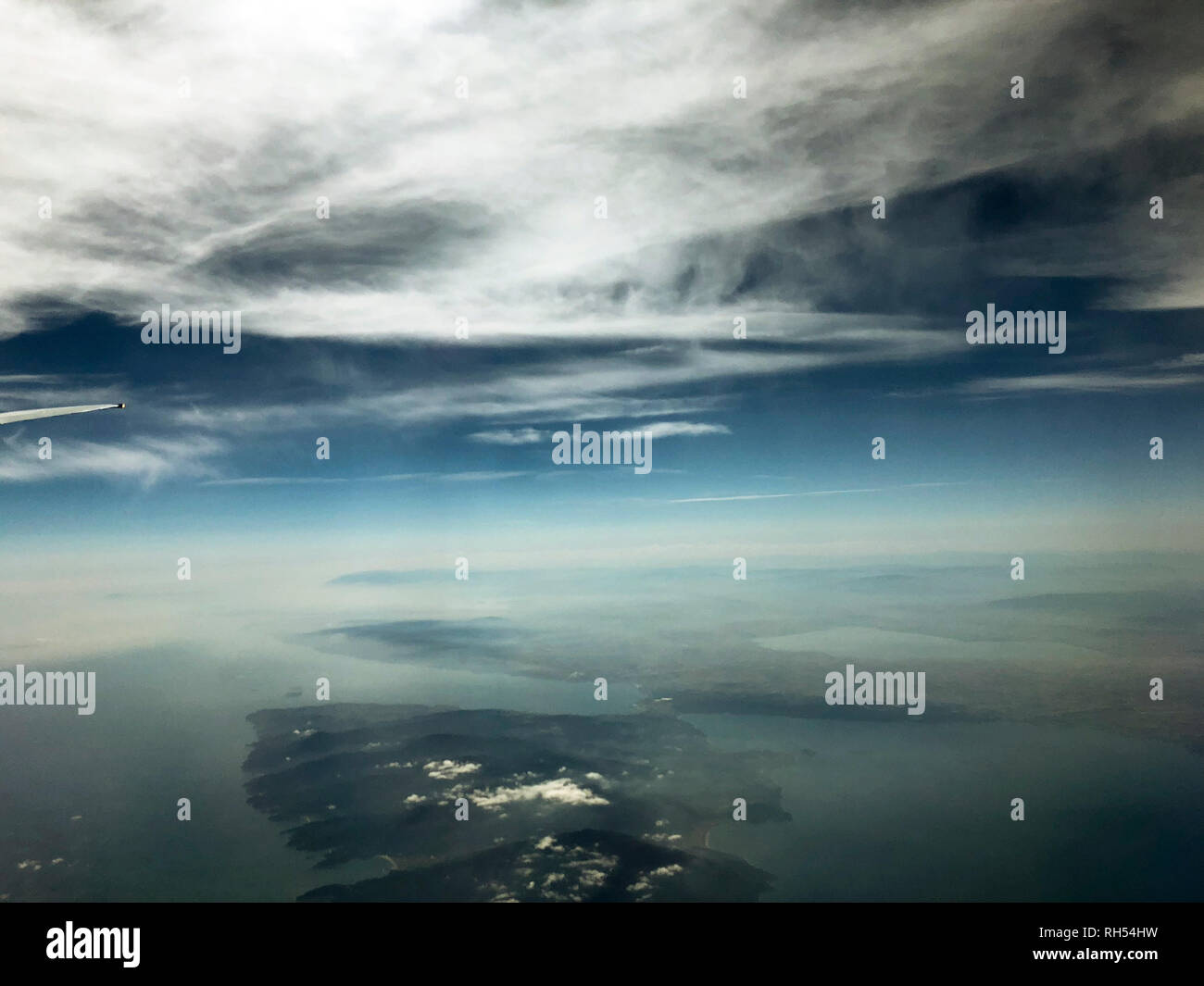 Landscape view from a window of a plane while in flight over Izmir city ...