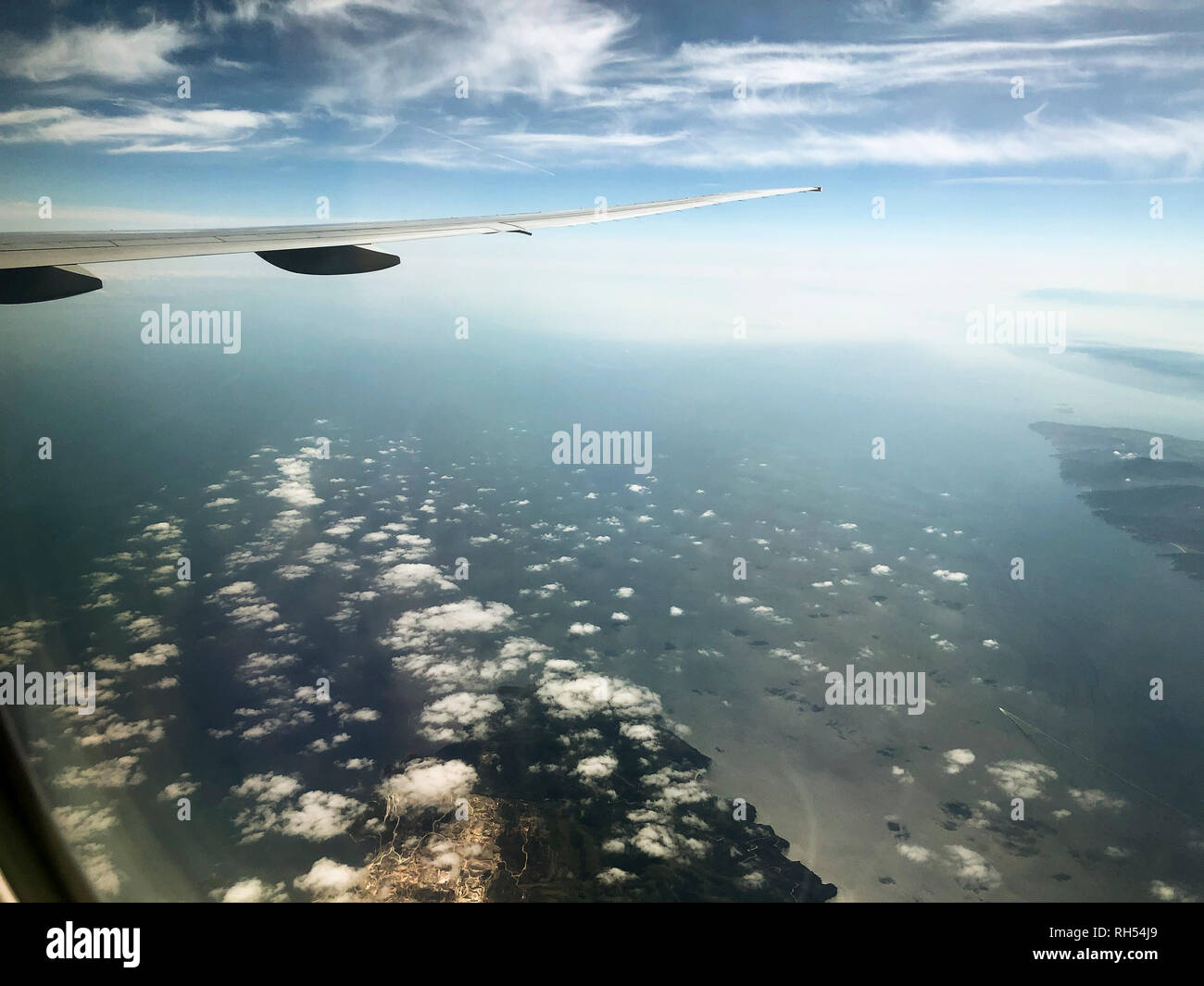 Landscape view from a window of a plane while in flight over Izmir city ...