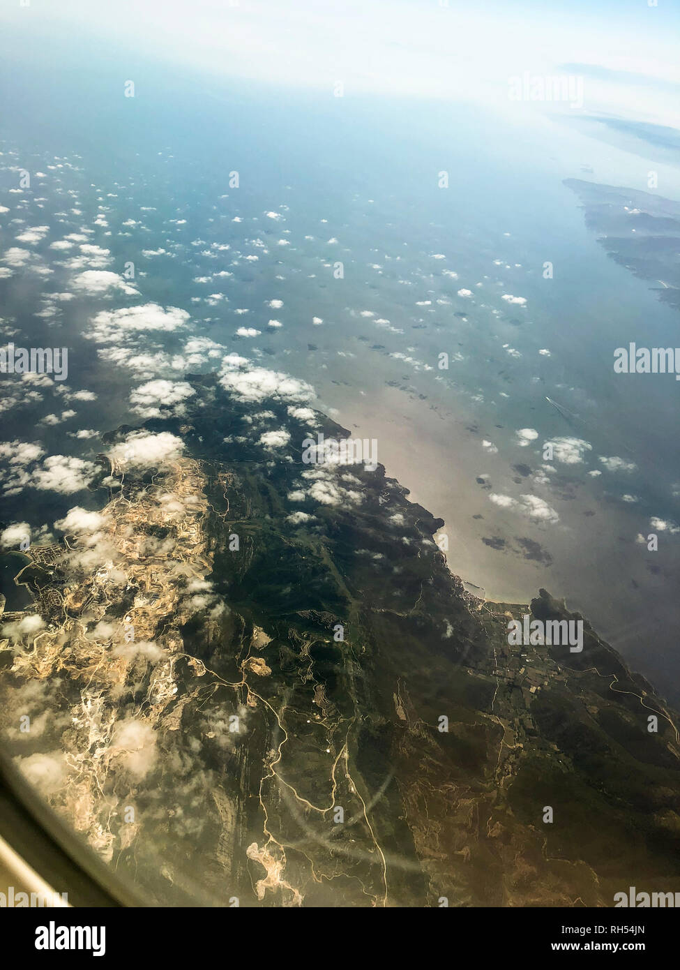 Landscape view from a window of a plane while in flight over Izmir city ...