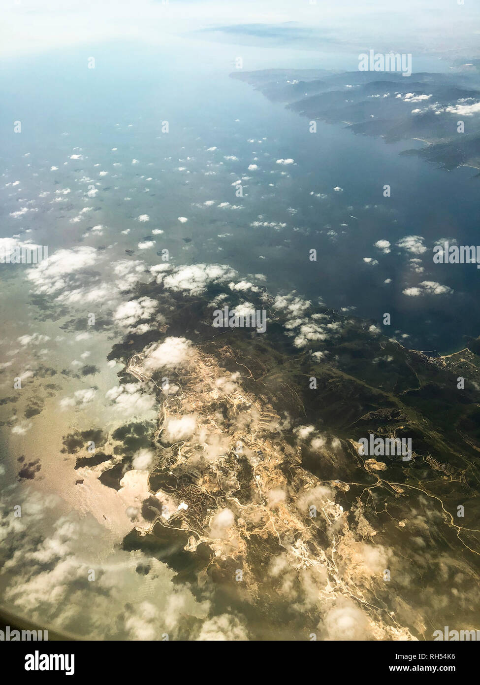 Landscape view from a window of a plane while in flight over Izmir city ...