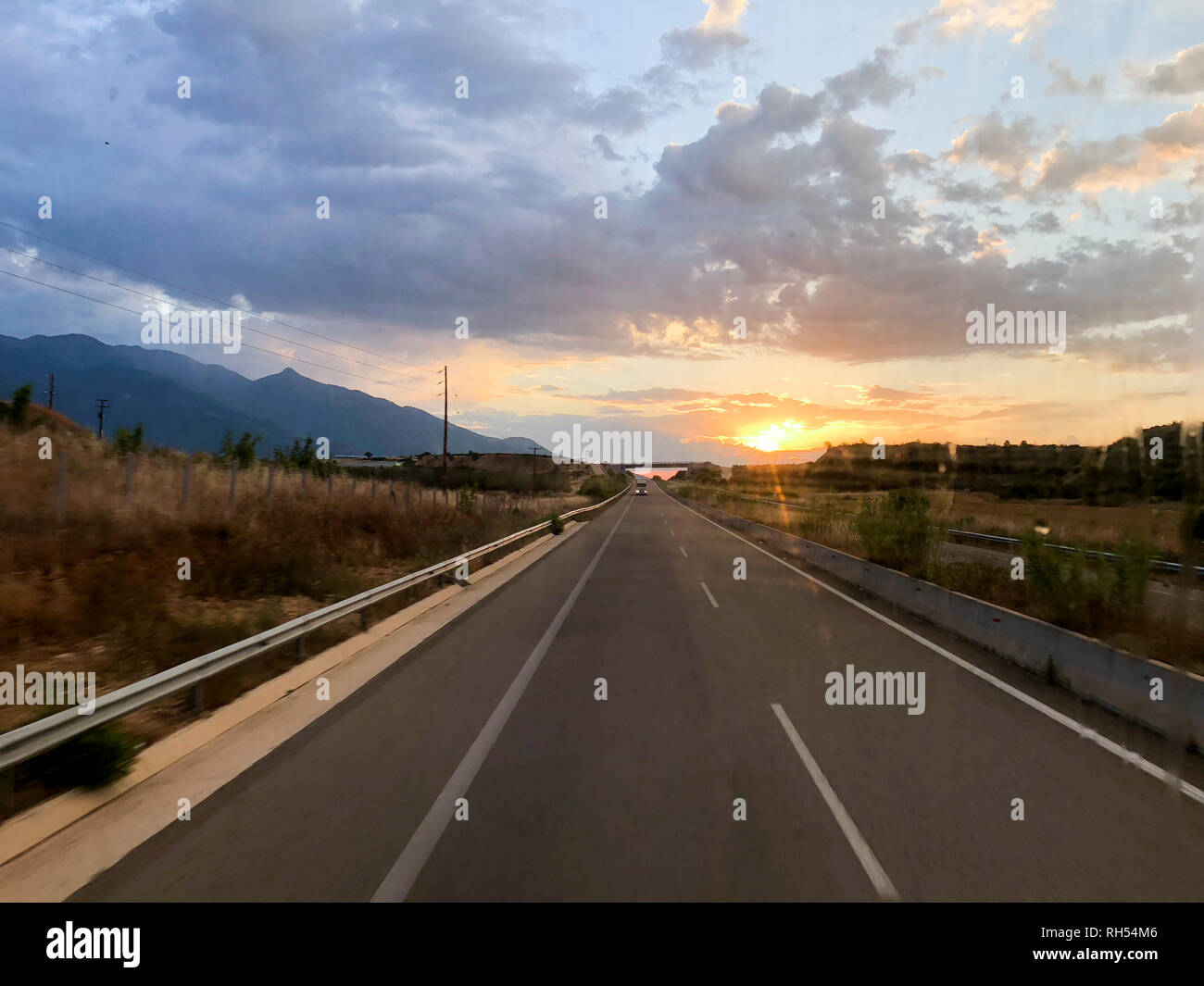 Empty road with sunbeams hi-res stock photography and images - Alamy