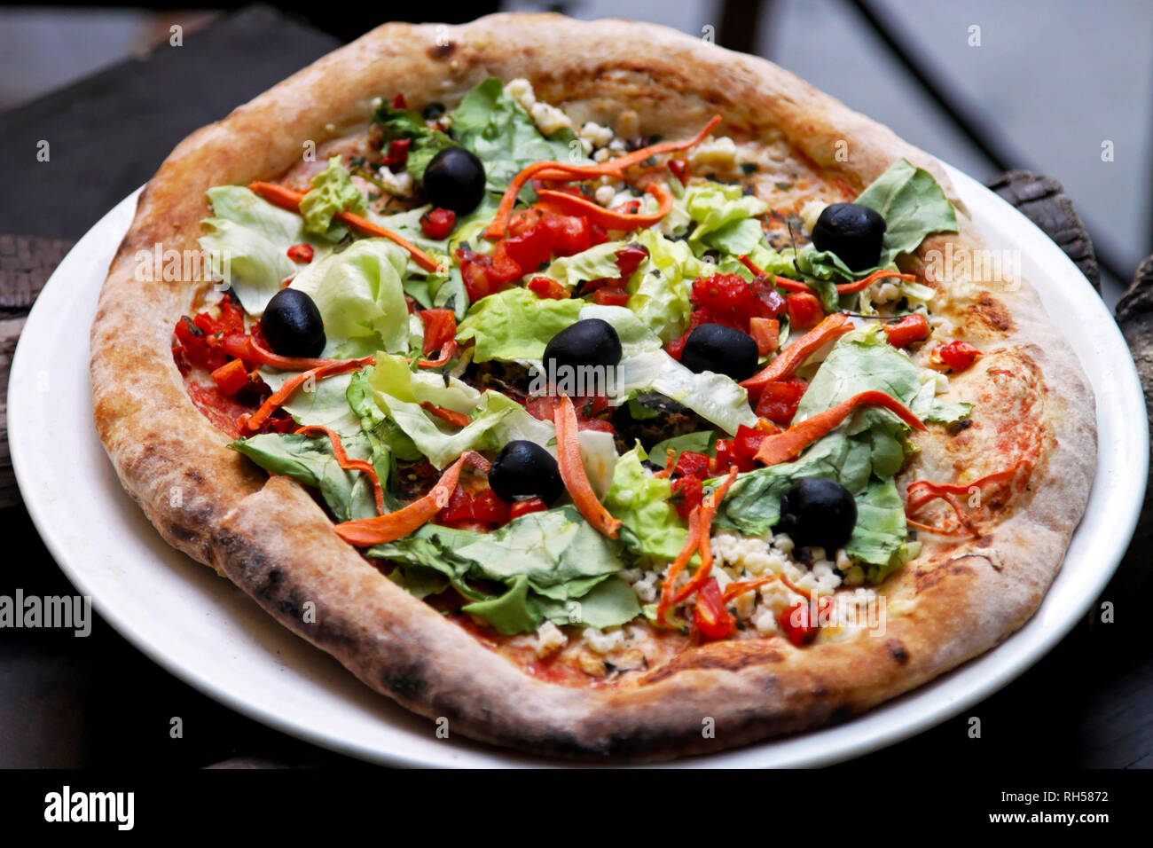 Traditional italian pizza from wood burning oven Stock Photo - Alamy