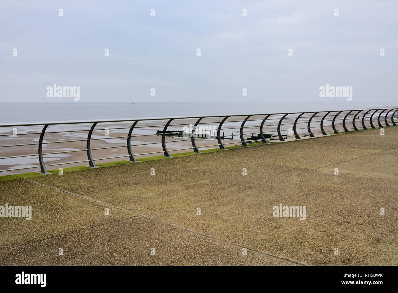 Stainless steel seafront balustrade bolted to concrete promenade ...