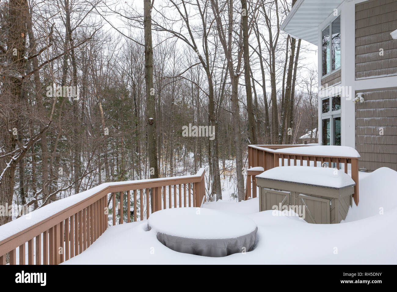 Outdoor patio buried under a fresh blanket of deep snow. Winter ...